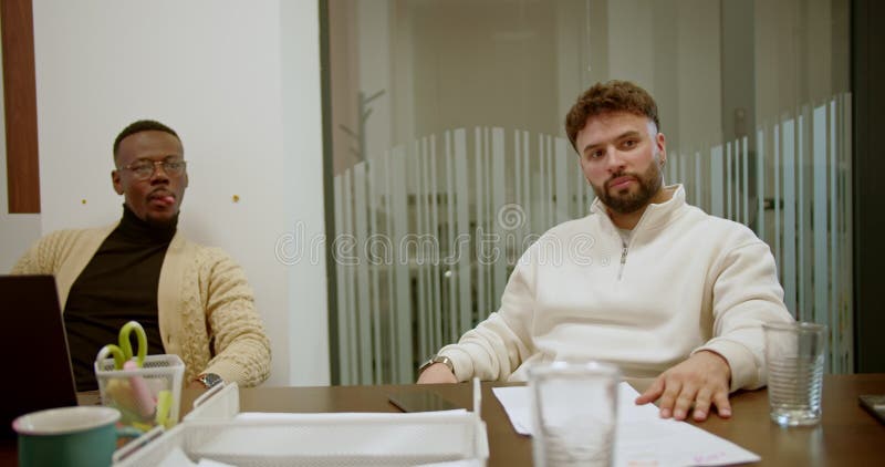 Two Men Engage in a Conversation during a Business Meeting in a Modern ...