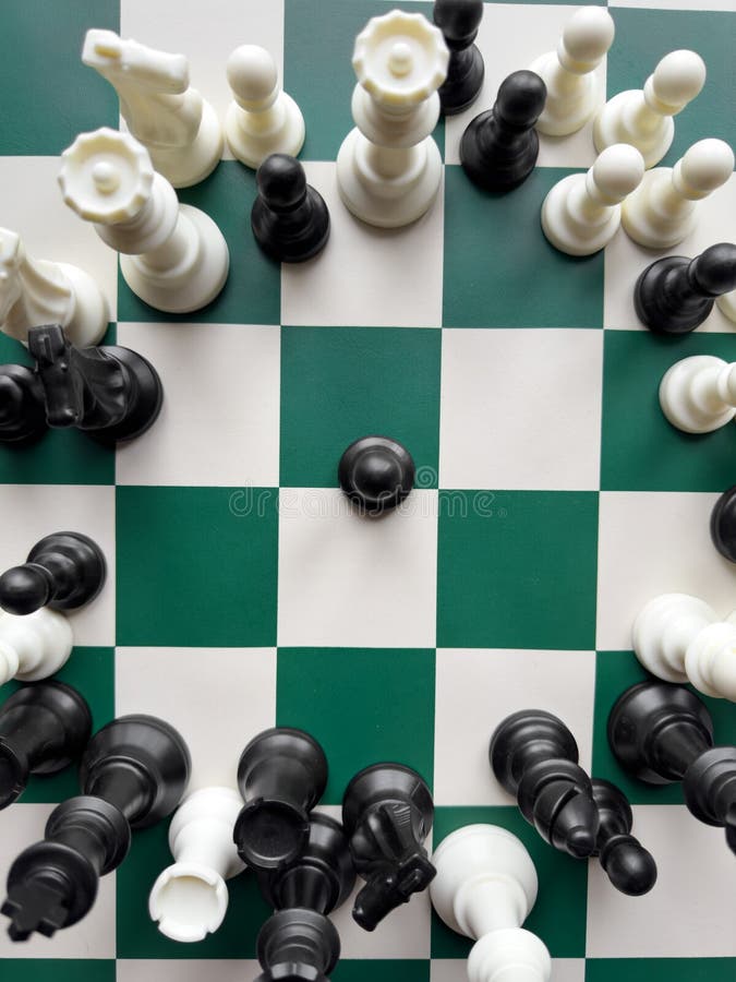 Dynamic Chess Game with Vibrant Black and White Pieces on a Checkered ...