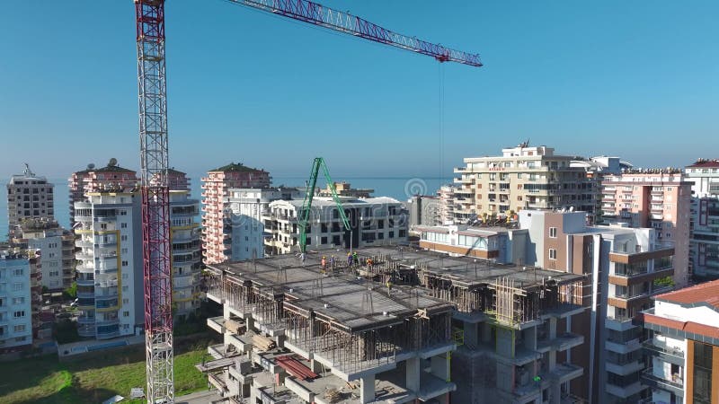 Aerial Video: Concrete Work and Cranes Operating on a High-Rise ...