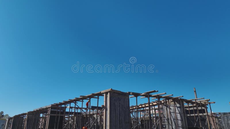 Aerial Video: Aerial Shot of Construction Workers Pouring Concrete on a ...