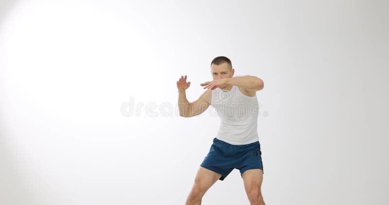 Dynamic Dance Workout with Energetic Movements of a Man in a Studio ...