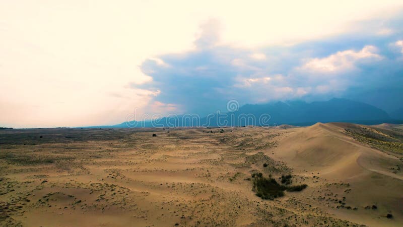 High-speed Drone Flyover of Desert Dunes with Dramatic Sky Stock Video ...