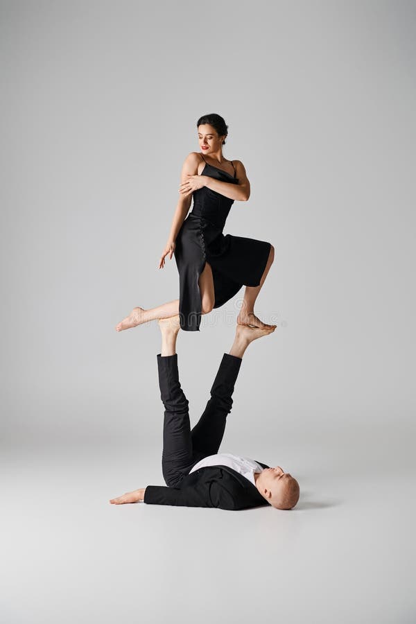 Dynamic Duo of Two Acrobats Performing Stock Image - Image of studio ...