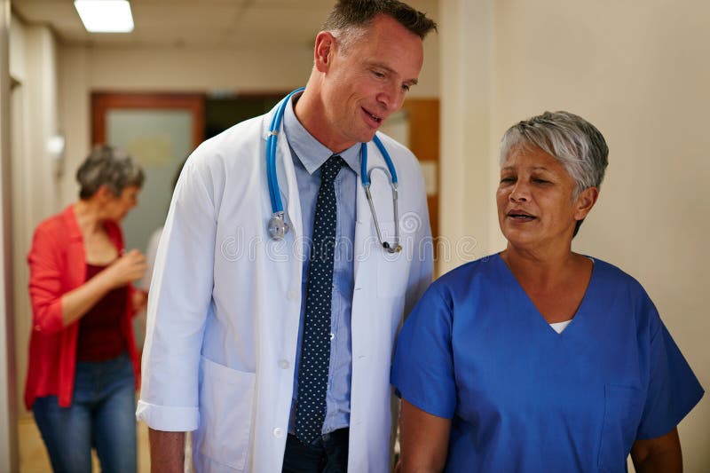 They are a Dynamic Duo. Two Medical Practitioners Having a Conversation ...