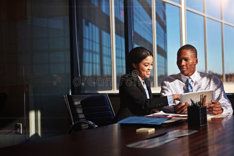 The Dynamic Duo. Two Young Businesspeople Meeting in the Boardroom ...