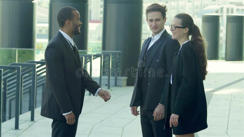 Dynamic Handshake among a Diverse Group of Smiling Business ...