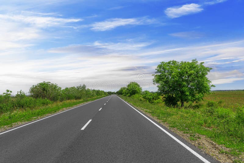A Dynamic Image of an Open Highway Surrounded by Greenery, with a ...
