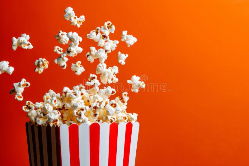 Popcorn Flying Out of Red White Striped Paper Box, Isolated on White ...