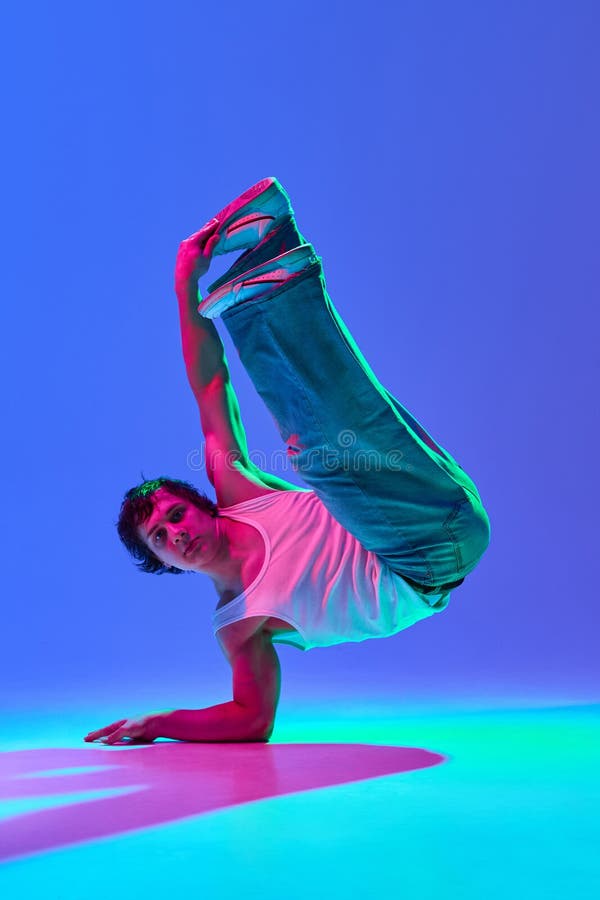 Young Breakdancer Balancing on One Hand Against White Background. Ffull ...
