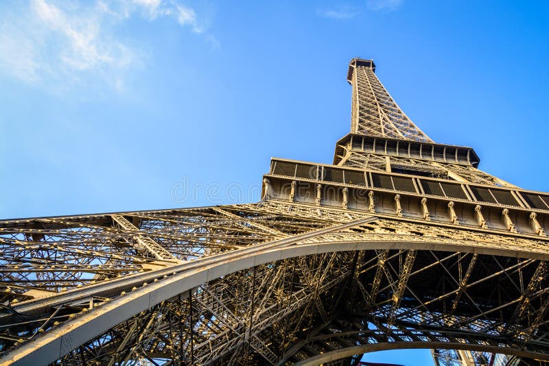 Dynamic Low Angle View of the Eiffel Tower Against Blue Sky Stock Image ...