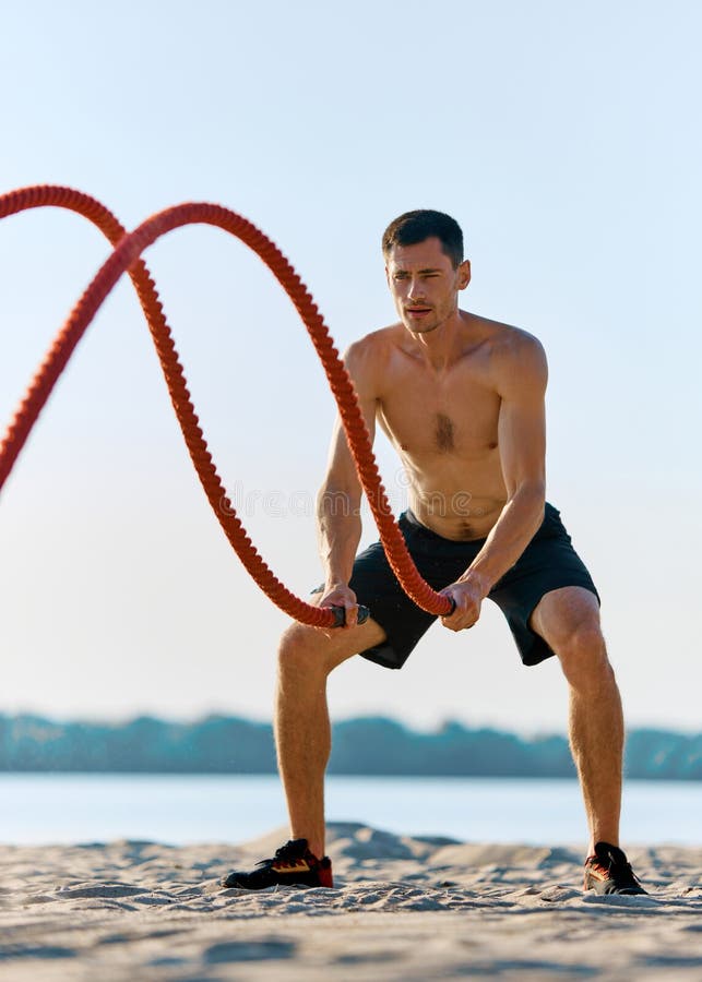 Dynamic Open Air Workout on Beach by the River. Muscular Athletic Man ...