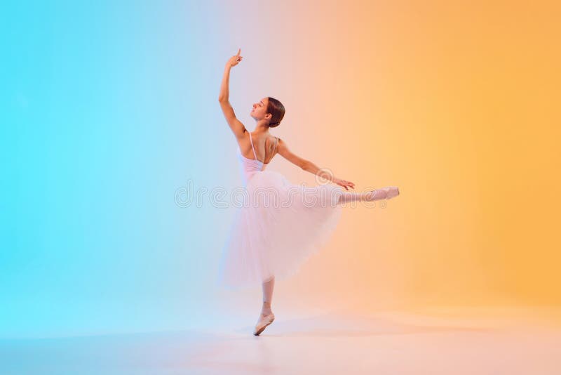 Dynamic Photo of Ballet Dancer Extends Her Arm Elegantly Dressed in ...