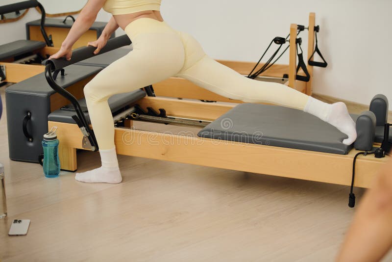 Dynamic Pilates Workout in a Modern Stock Photo - Image of pose ...