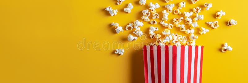 Dynamic Popcorn Cascade Buttered Kernels Spilling from Red Striped Bag ...