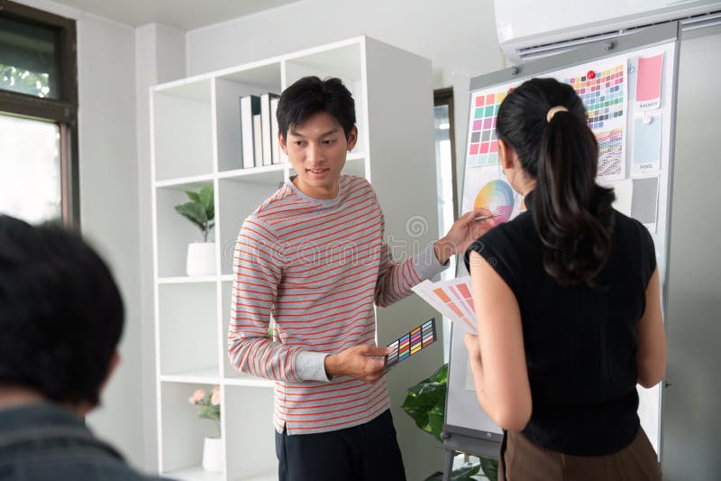 Visual Presentation and Group Dynamics. a Team Member Presenting Design ...