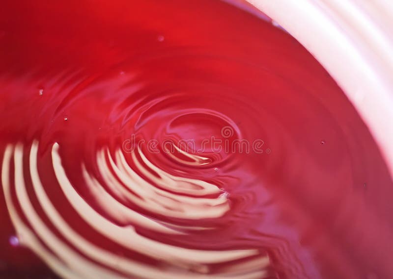 Abstract Ripples in Vibrant Red Liquid Creating Dynamic Wave Patterns ...
