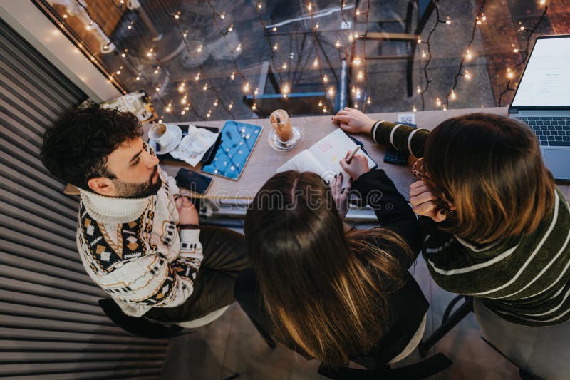 A Dynamic Scene of Young Individuals Engaging in Teamwork Around a ...