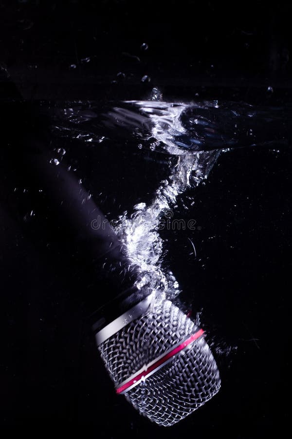 A Microphone Splashing into the Water. Microphone Stock Image - Image ...