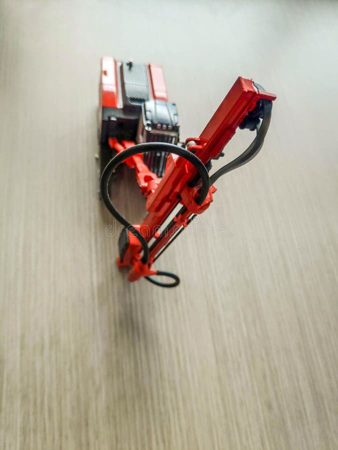 A Dynamic Shot of a Red Drilling Machine Model Stock Photo - Image of ...