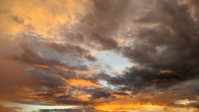 A Dynamic Sky Features Dark, Textured Clouds Contrasted by Patches of ...