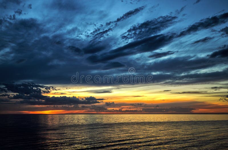 A dynamic sky sunset stock photo. Image of ocean, colorful - 73460104