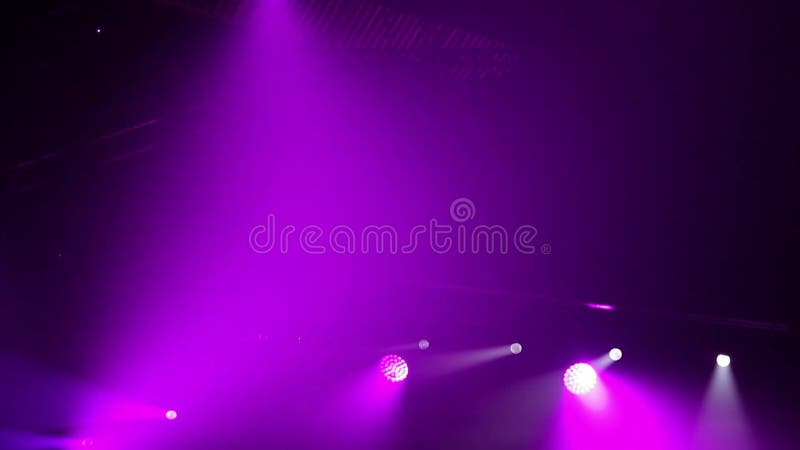 Dynamic Stage Lighting with Rays of Blue Light Cutting through Haze in ...