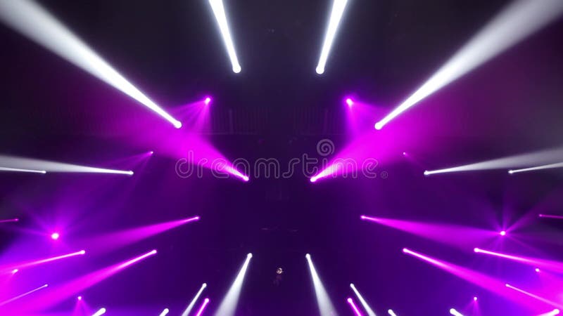 Dynamic Stage Lighting with Rays of Blue Light Cutting through Haze in ...