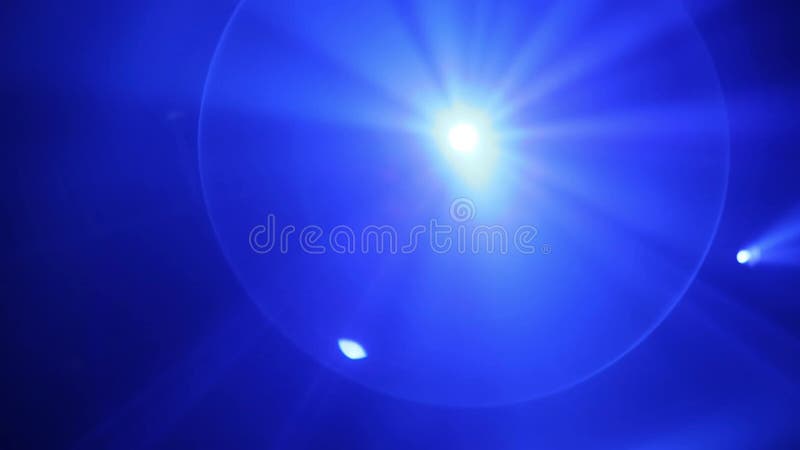 Dynamic Stage Lighting with Rays of Blue Light Cutting through Haze in ...