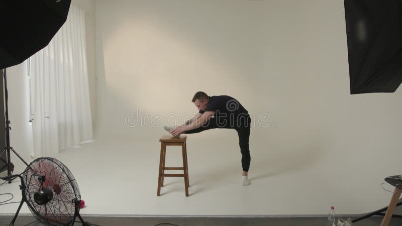 The Dynamic Stretching Pose in a Studio Captures the Essence of ...