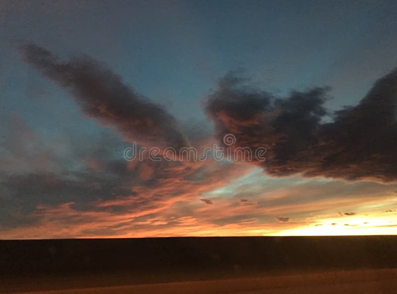 Dynamic Sunset Over the Prairies Stock Image - Image of flat, clouds ...