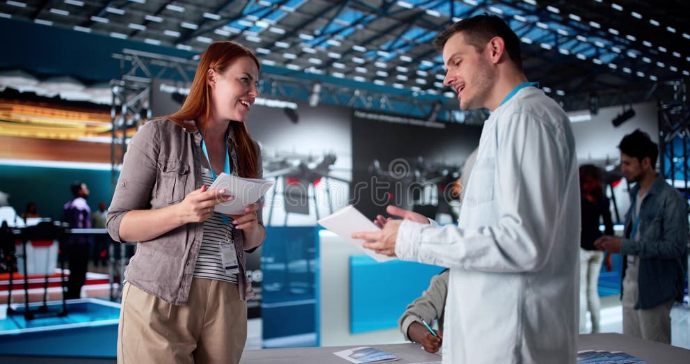 Dynamic Team of Sales Representatives Engaging Multiracial Crowd Stock ...