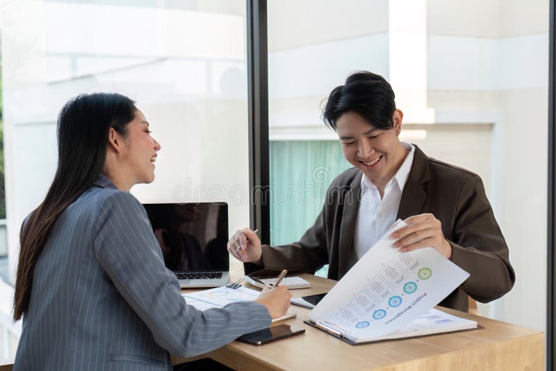 Dynamic Teamwork. Professionals Enjoying a Collaborative Session while ...