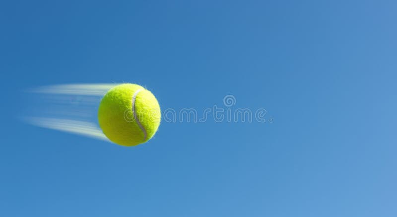 Dynamic Tennis Ball in Motion Against Clear Blue Sky Stock Photo ...