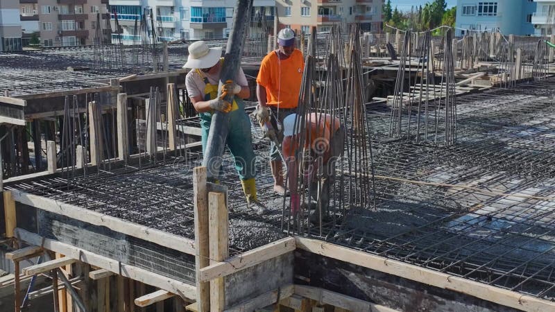 Aerial View: Concrete Pouring in Full Swing As Construction Workers and ...