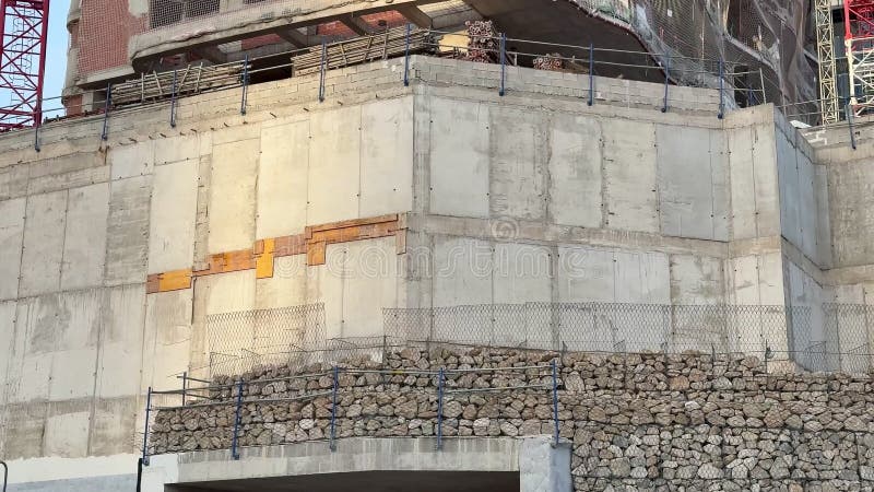 Detailed Construction Progress of a Modern Building Featuring Crane ...