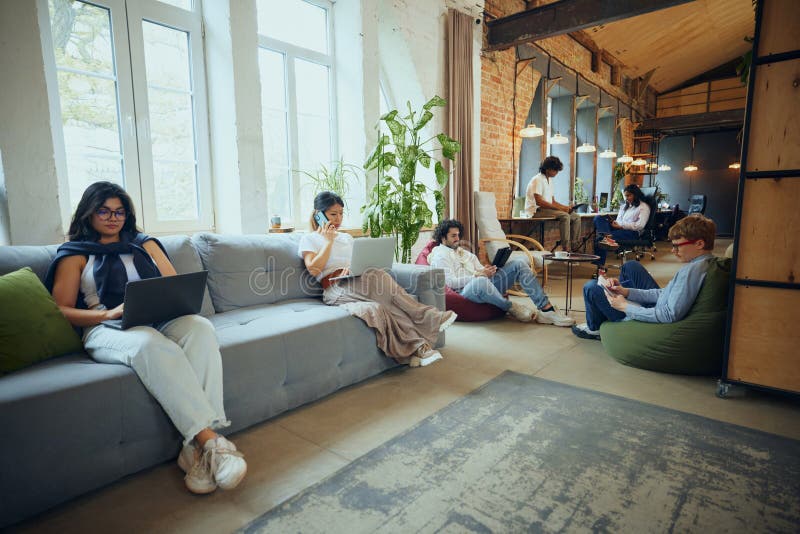 Dynamic Workday. Young Multiethnic People Meeting in Co-working ...