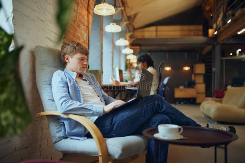 Dynamic Workspace. Lively Coworking Space Filled with Young People ...