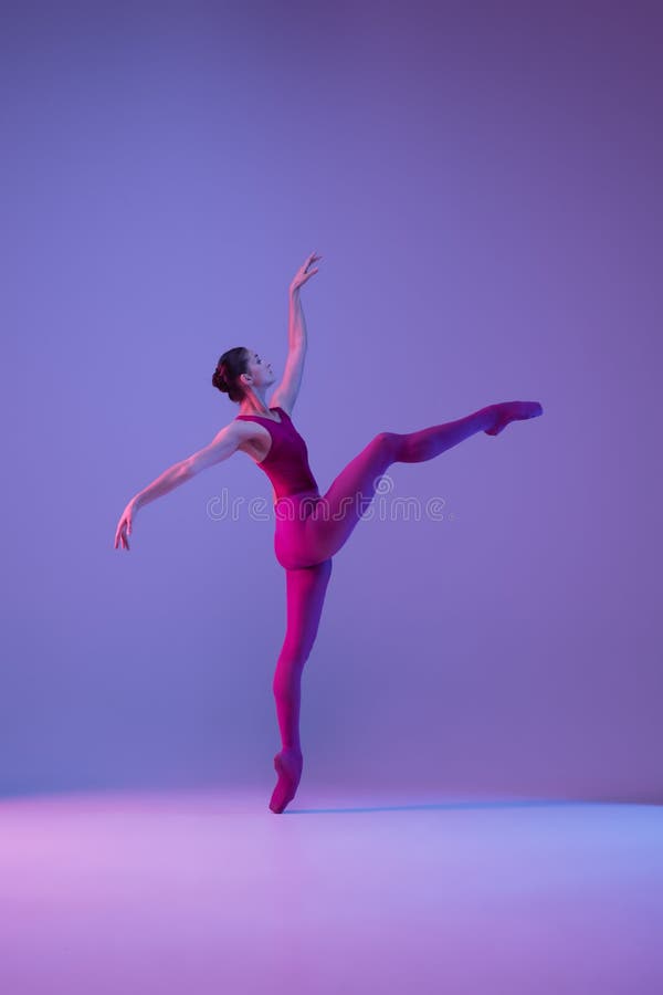 Young and Graceful Ballet Dancer Isolated on Purple Studio Background ...