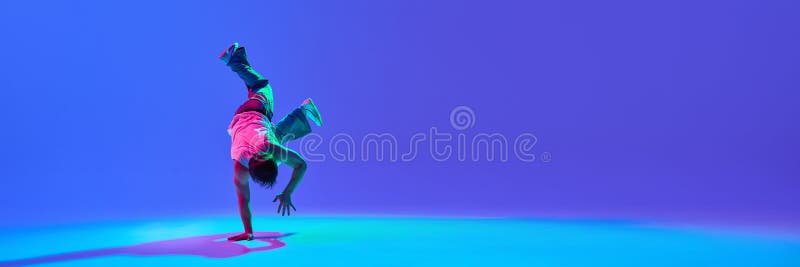 Dynamic Young Guy, Dancer Executing Powerful Breakdance Move, Blending ...