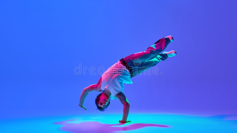 Dynamic Young Performer Executing Powerful Breakdance Move, Blending ...