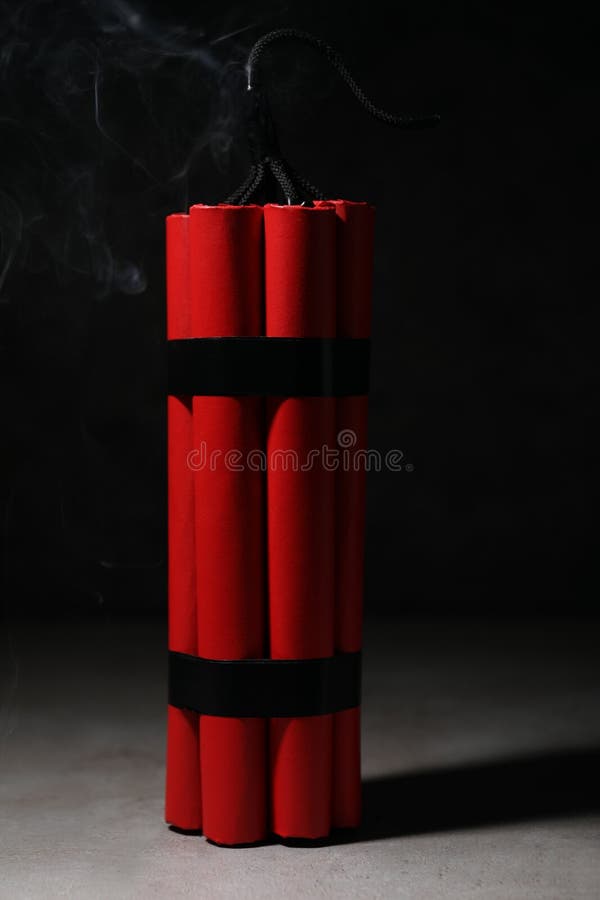 Dynamite Bomb on Grey Table Against Black Background Stock Photo ...