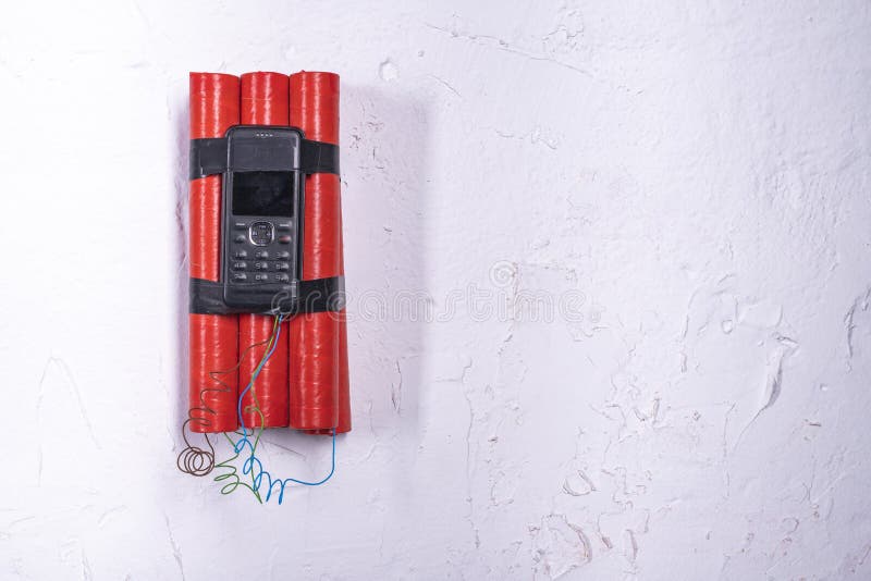 Dynamite with a Remote Fuse Hung on a White Wall. an Explosive Charge ...