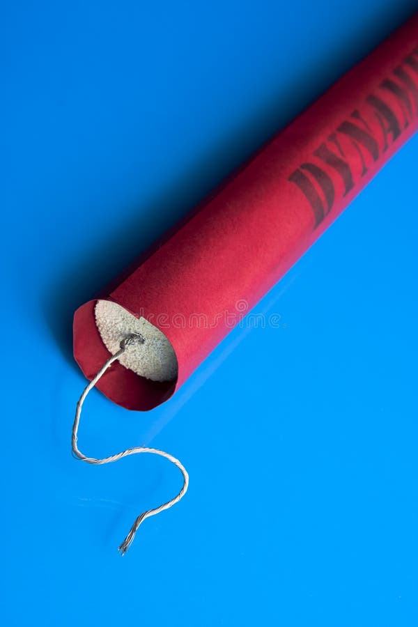Lit Dynamite Stick on a Blue Background Stock Image - Image of warning ...