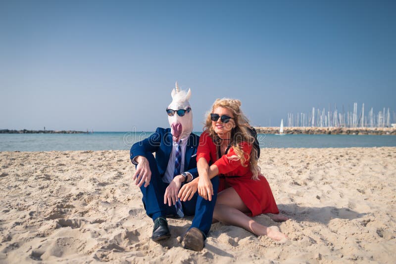 Unusual Couple are Sunbathing on the Beach and Enjoys Vacation ...
