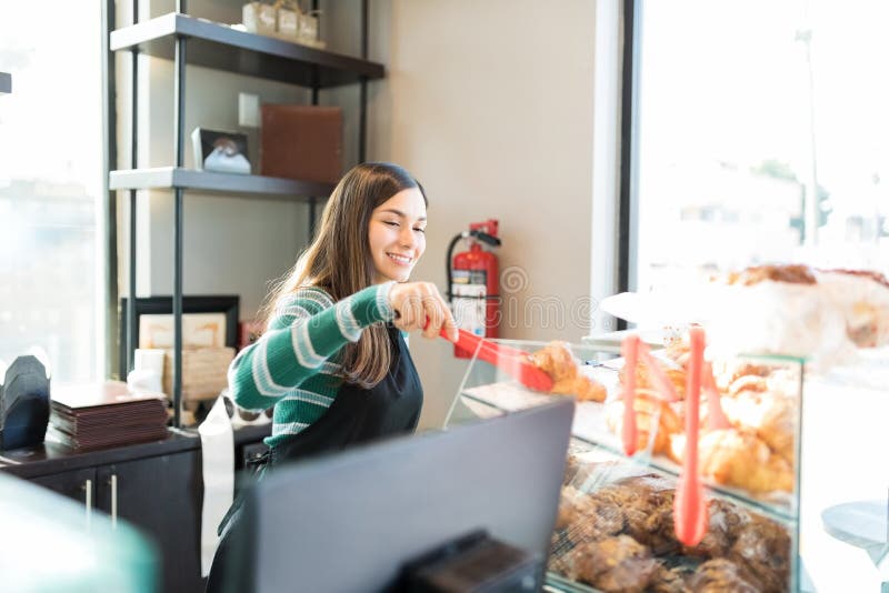 Smiling Worker Arranging Breads in Bakery Zdjęcie Stock - Obraz ...