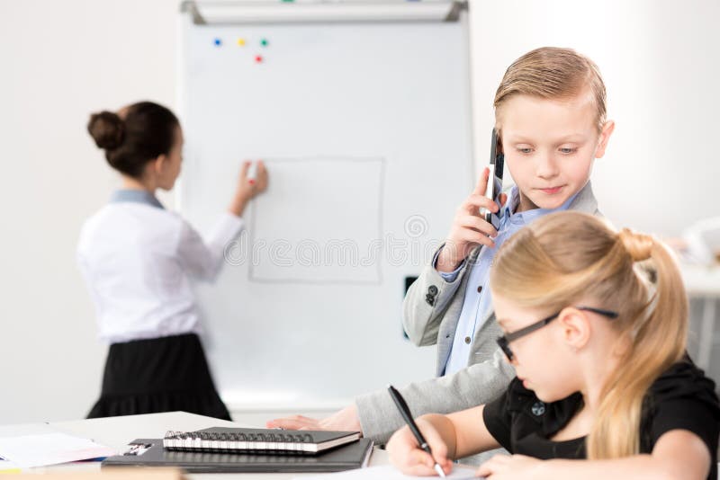 Children working in office fotografia stock. Immagine di formazione ...