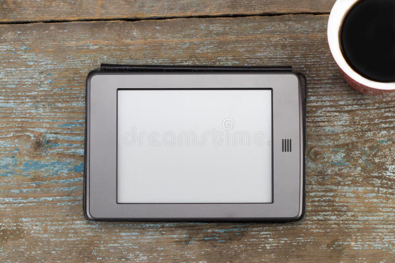 E-book Reader and Coffee Cup on Wooden Table Stock Photo - Image of ...