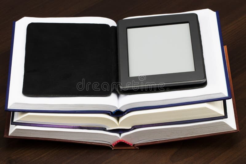 E-book Reader Device on Desk in Library. Alternative for Traditional ...