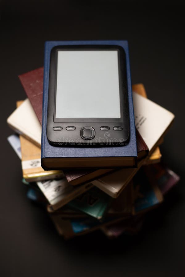 E-book on a Stack of Ordinary Paper Books Editorial Stock Image - Image ...