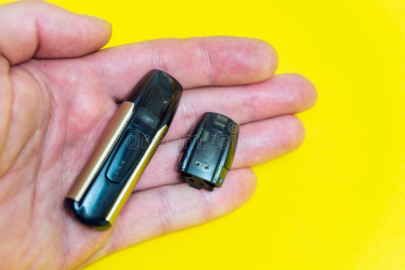 E-cigarette for Smoking and Spare Cartridge on Hand Stock Photo - Image ...